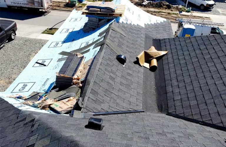 Asphalt shingle with dead valley and barrel roofs